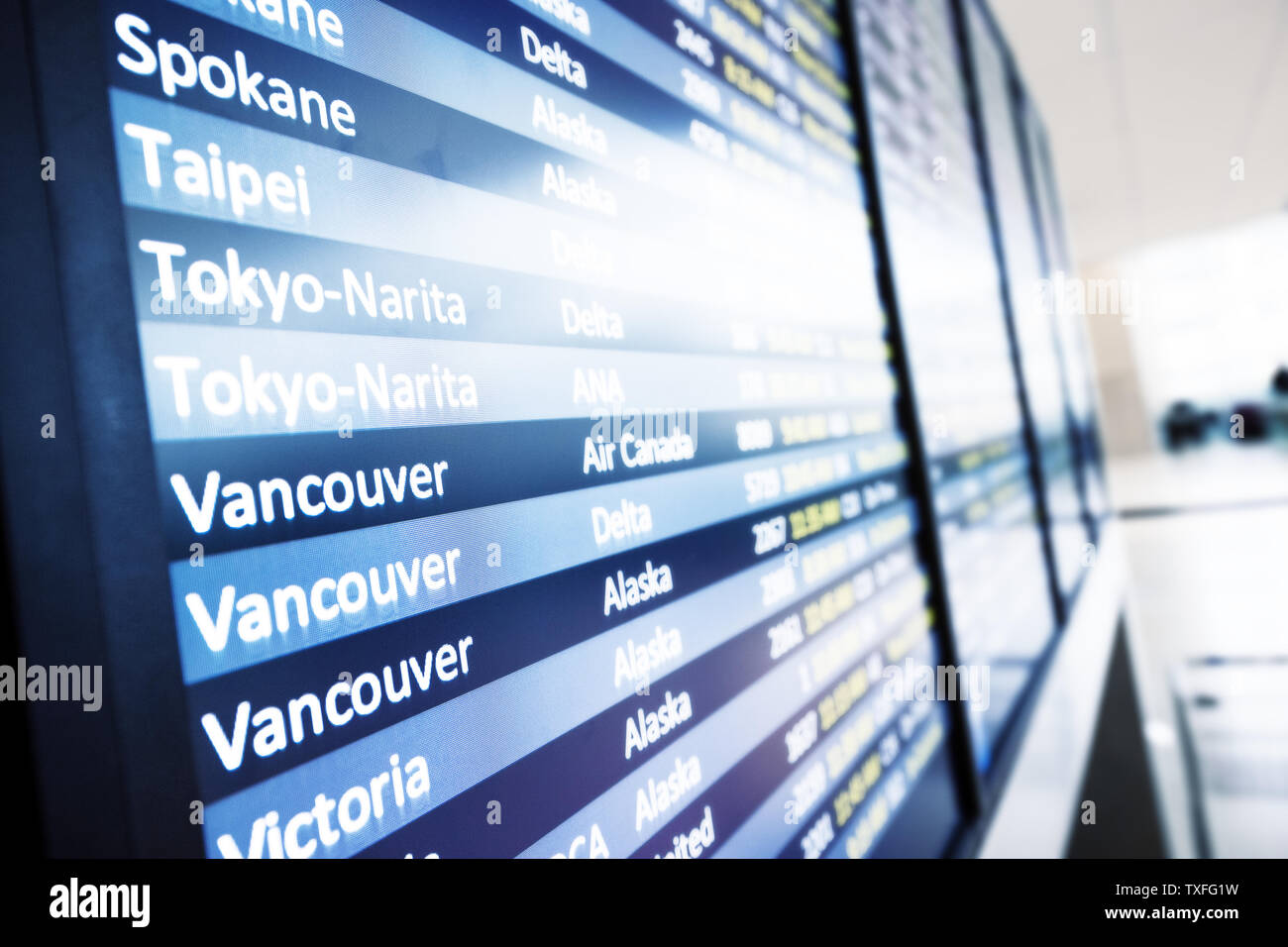 info of flight on billboard in airport Stock Photo - Alamy