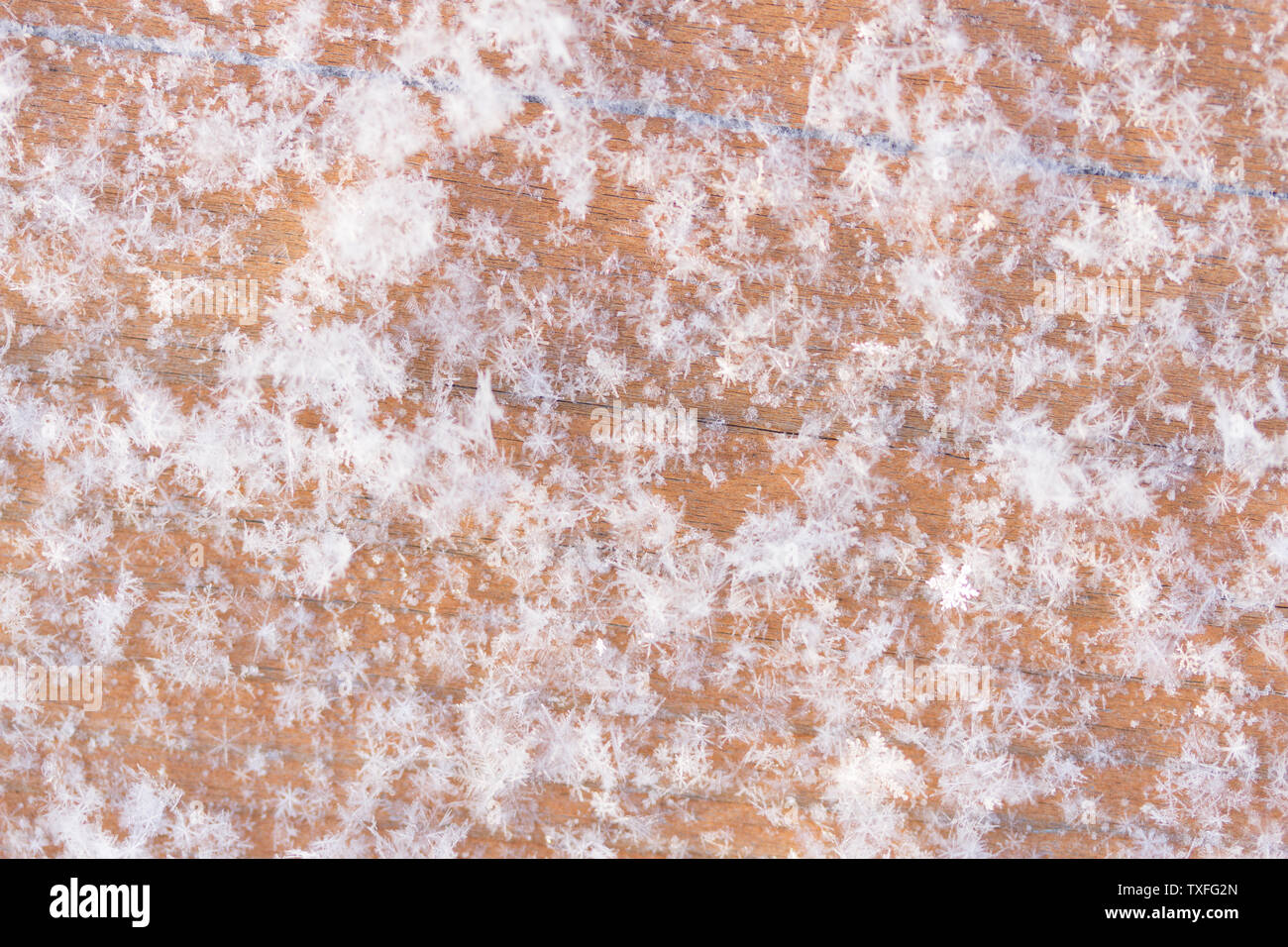 Snowy brown wooden background. warm color tone Stock Photo - Alamy
