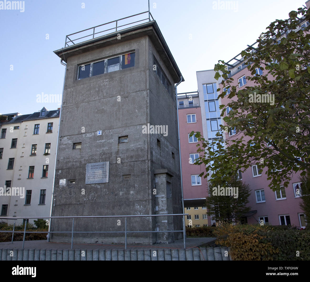 An original Berlin Wall guard tower rests inside an apartment complex ...