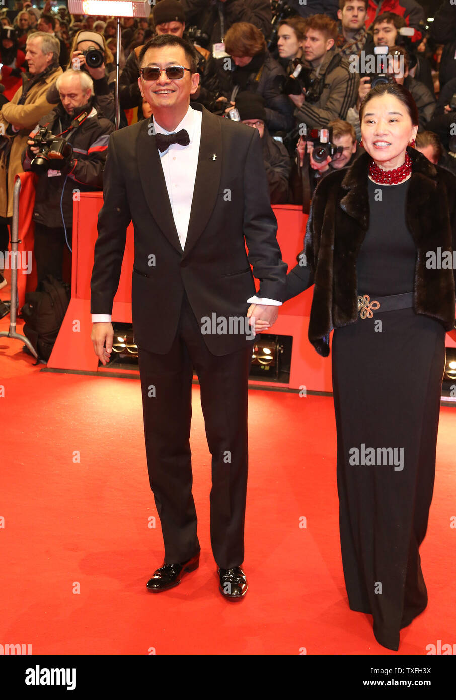 Wong Kar Wai (L) and Esther Wong arrive on the red carpet for the film ...