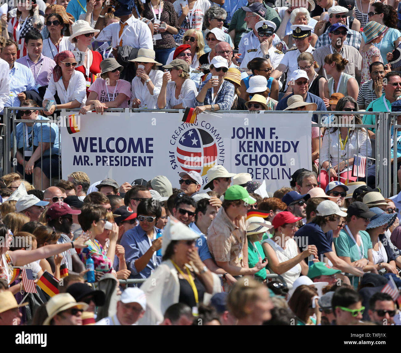 Attendees present a banner during a speech by U.S. President Barack ...