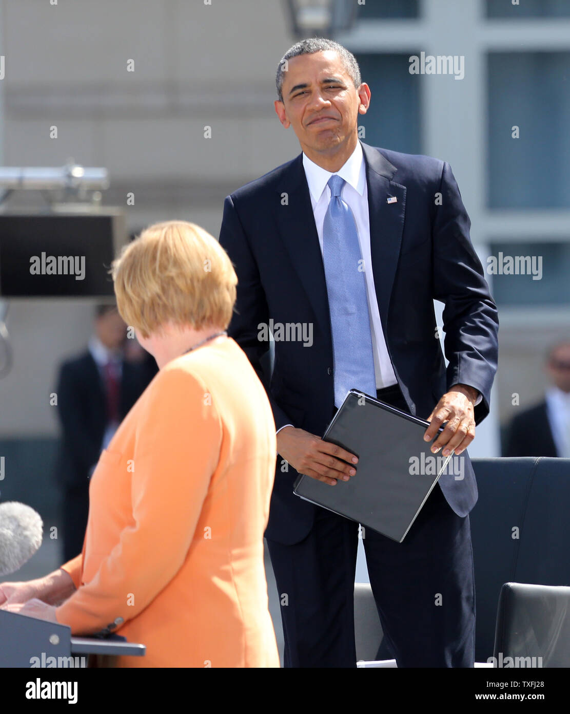 U.S. President Barack Obama reacts after German Chancellor Angela ...
