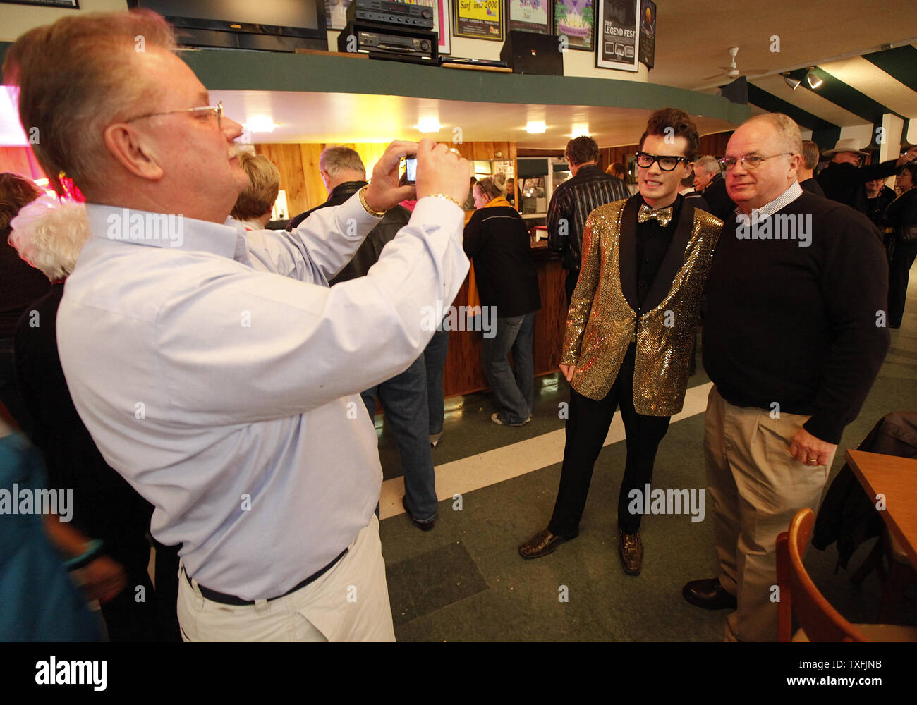 Walt Prindle (L) takes a photo of his friend Gary Brookins (R) with ...