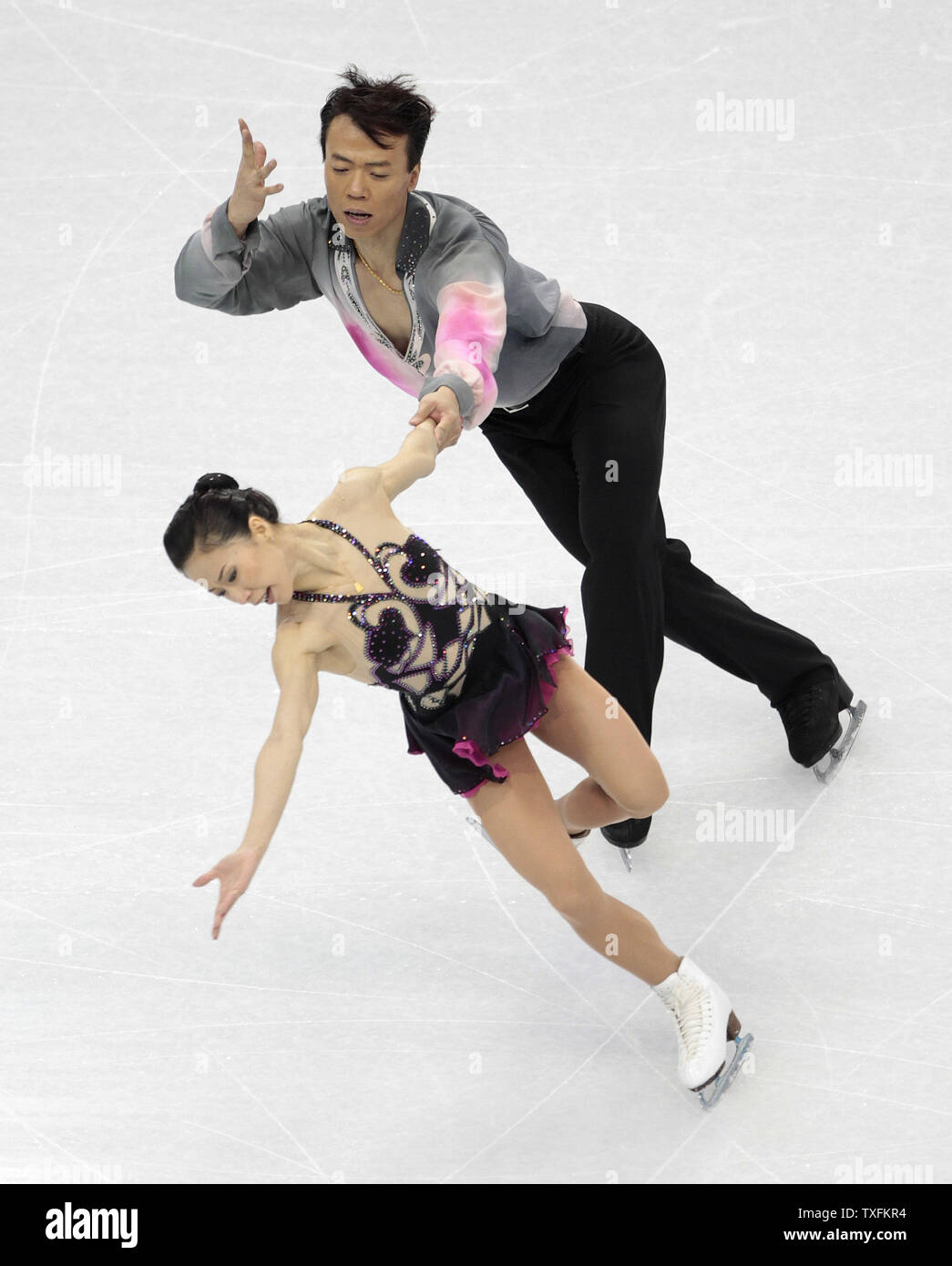 Xue Shen (bottom) and Hongbo Zhao of China skate during their short ...