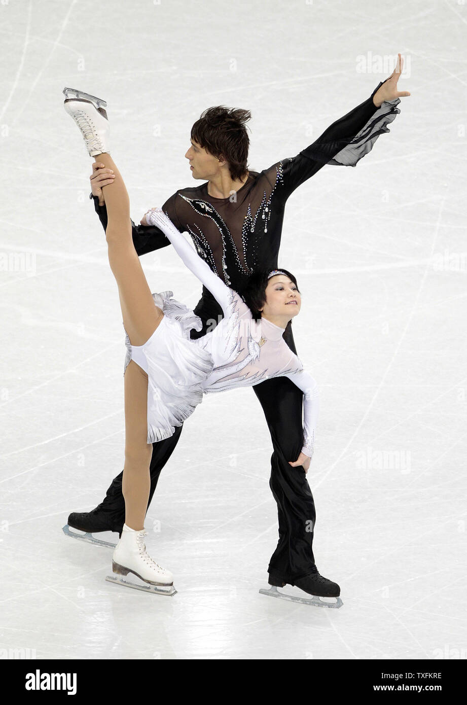 Yuko Kavaguti (front) and Alexander Smirnov of Russia skate during ...