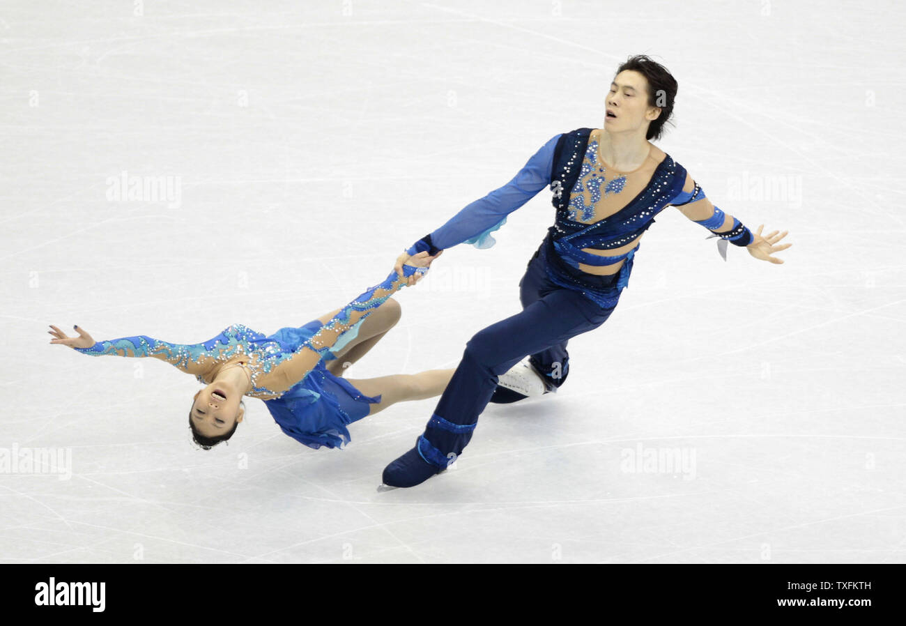 Qing Pang (L) and Jian Tong of China skate during their short program ...
