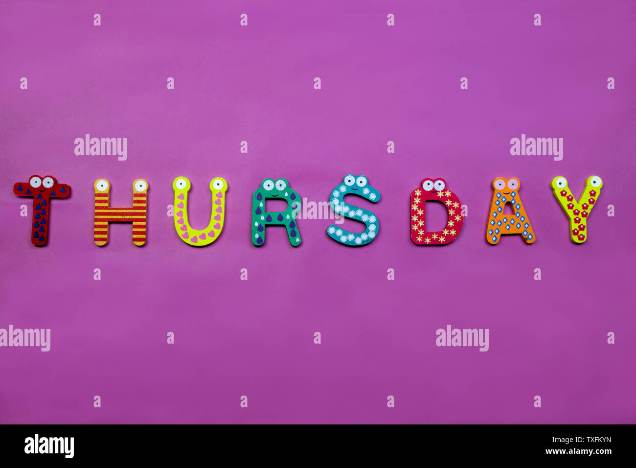 Color building blocks English words Thursday Stock Photo - Alamy