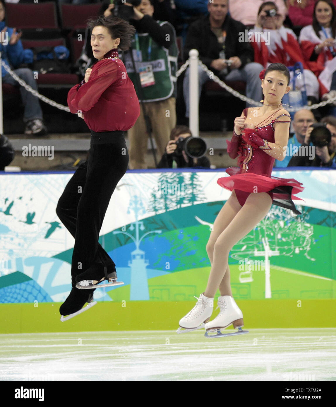 Qing Pang (R) and Jian Tong of China skate during Figure Skating Pairs ...