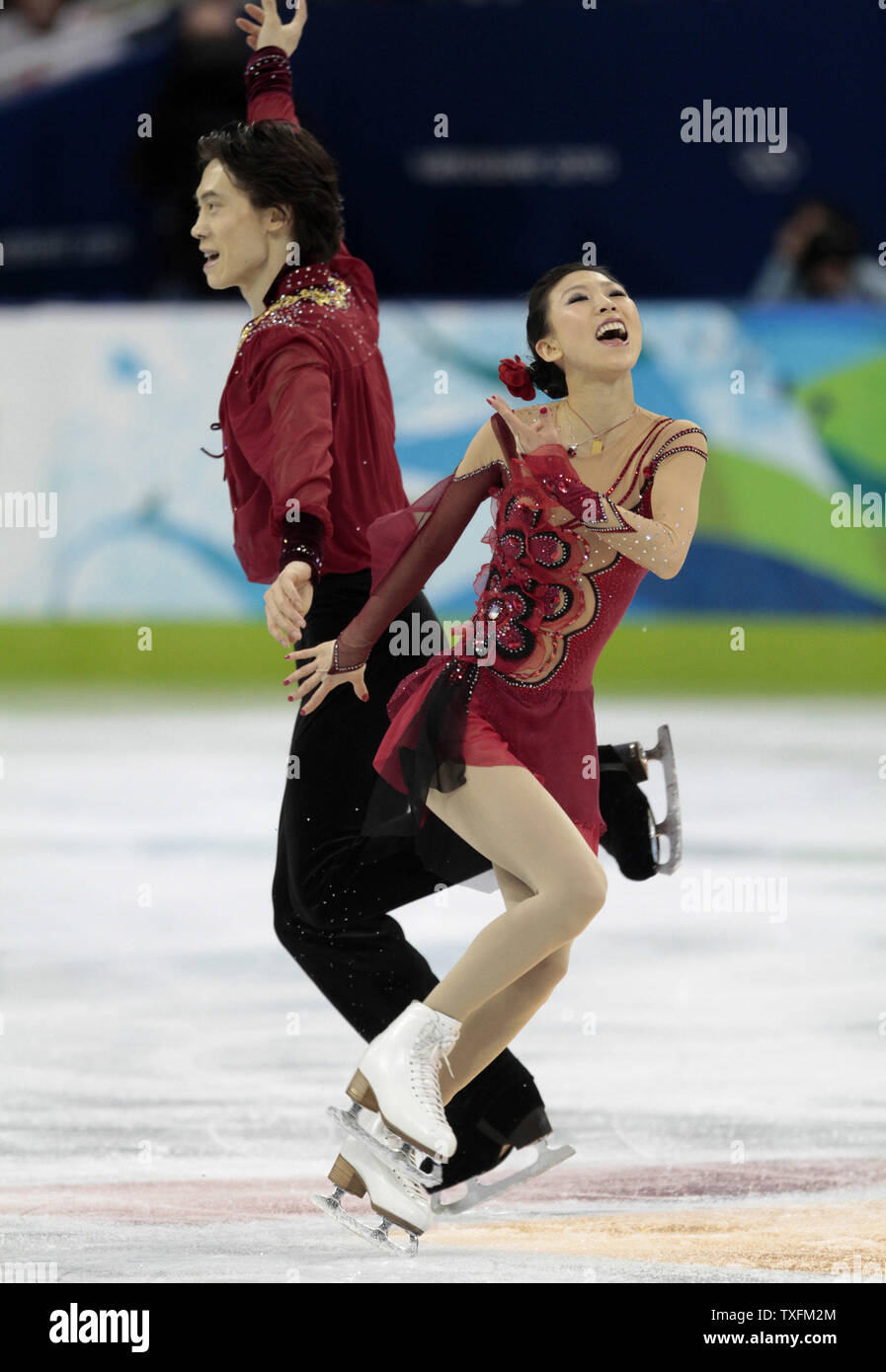 Qing Pang (R) and Jian Tong of China skate during Figure Skating Pairs ...