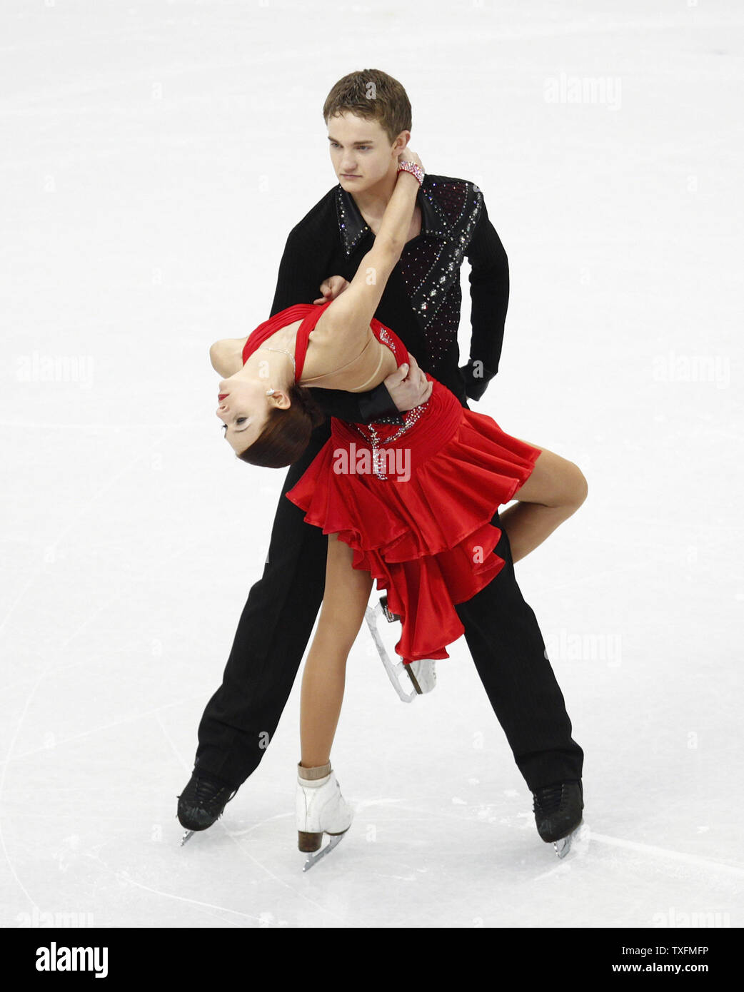 Irina Shtork (L) and Taavi Rand of Estonia skate the compulsory ice ...