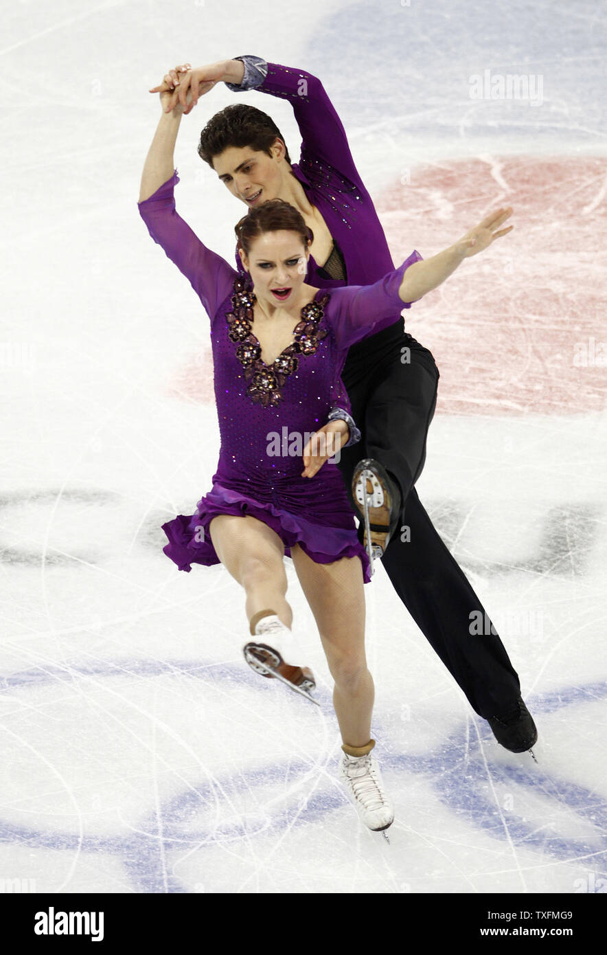 Vanessa Crone (front) and Paul Poirier of Canada skate the compulsory ...