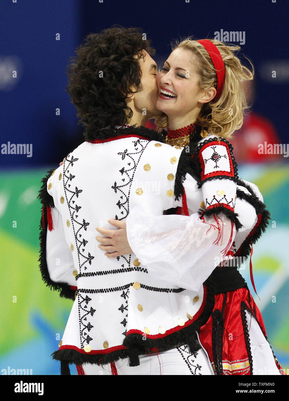 Tanith Belbin (R) and Benjamin Agosto of the United States embrace ...
