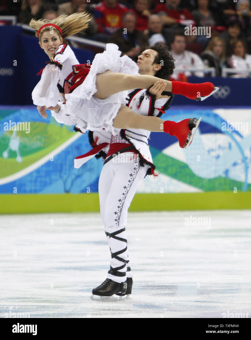 Tanith Belbin (L) and Benjamin Agosto of the United States skate during ...