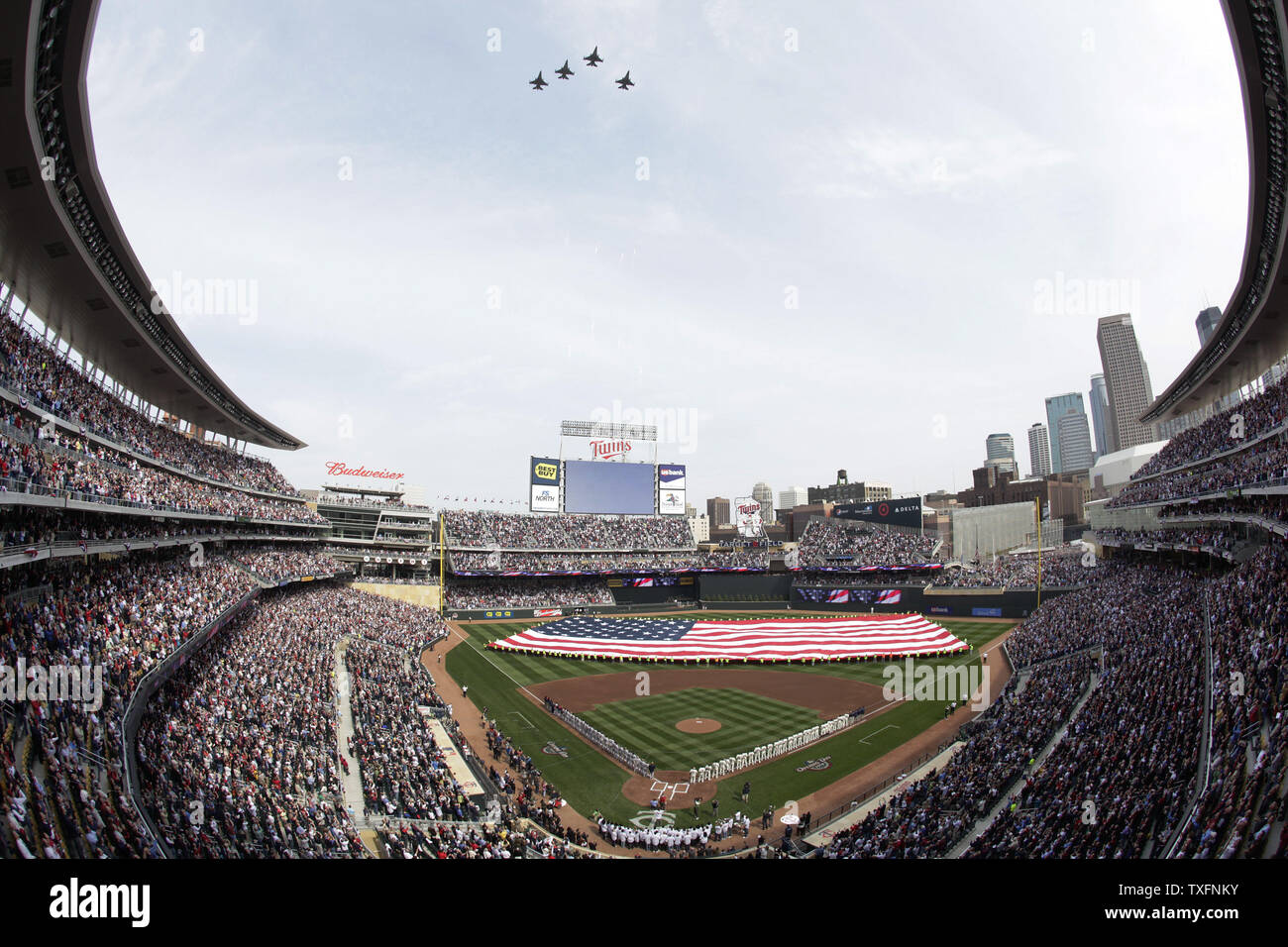 U.S. Military fighters fly over Target Field during the playing of the ...