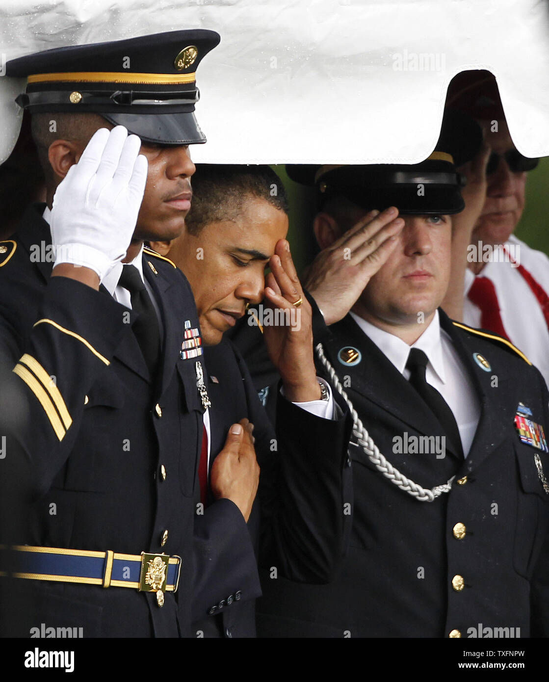 U. S. President Barack Obama (C) stands during the playing of the Star ...