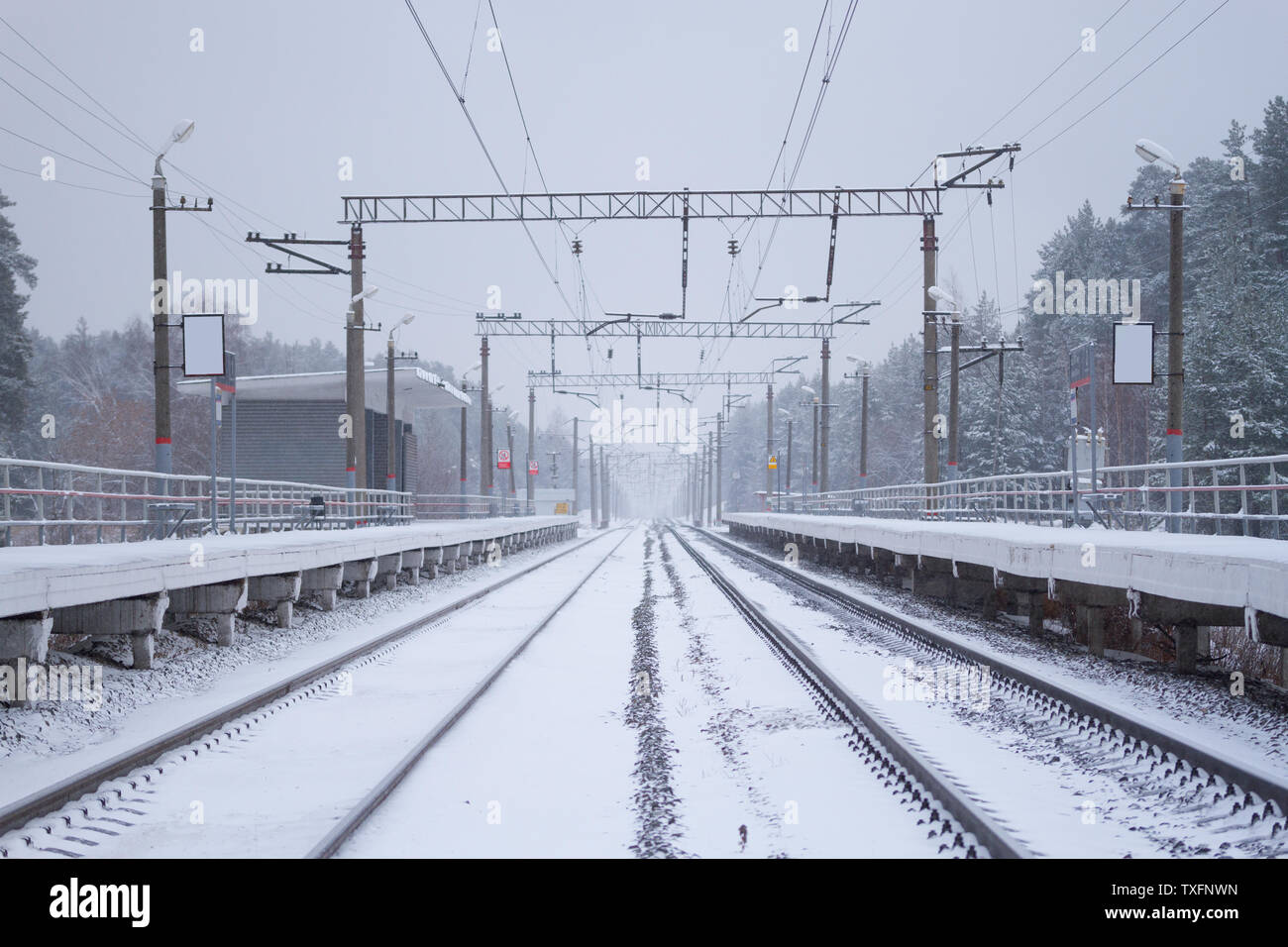 scary landscape with rail road in winter Stock Photo - Alamy