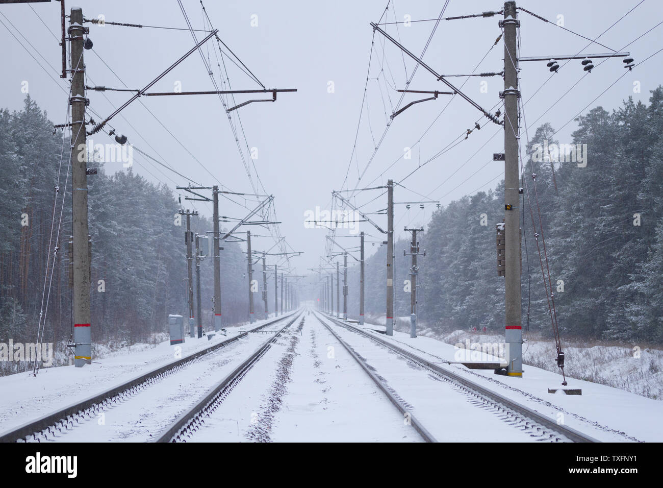 scary landscape with rail road in winter Stock Photo - Alamy