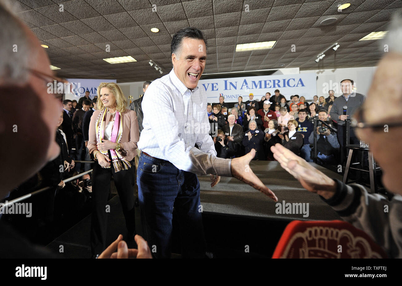 Republican presidential hopeful Mitt Romney shakes hands with ...