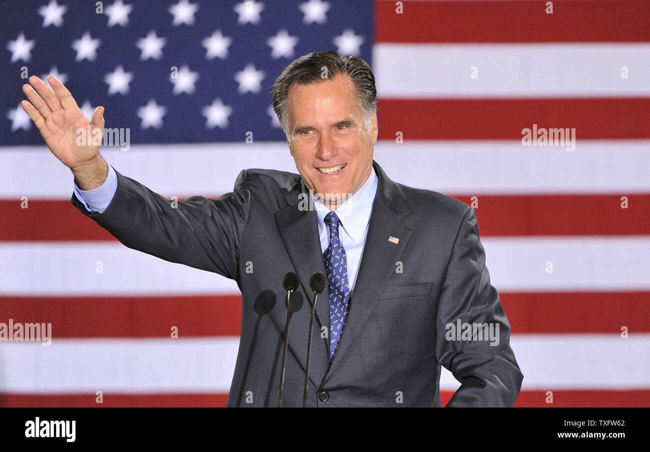 Republican Presidential hopeful Mitt Romney waves to supporters at a ...