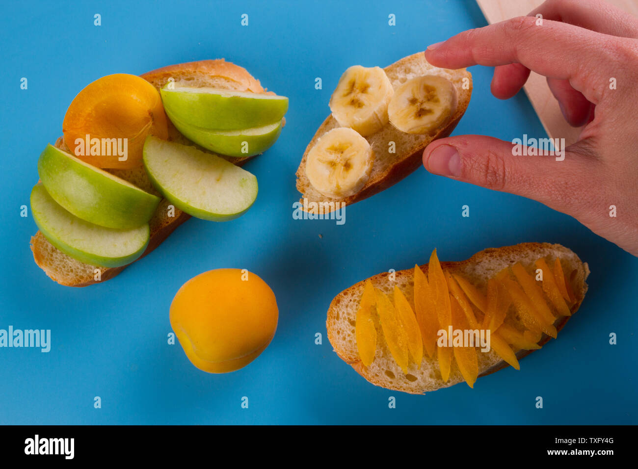 sandwiches with fruits on the blue background Stock Photo - Alamy