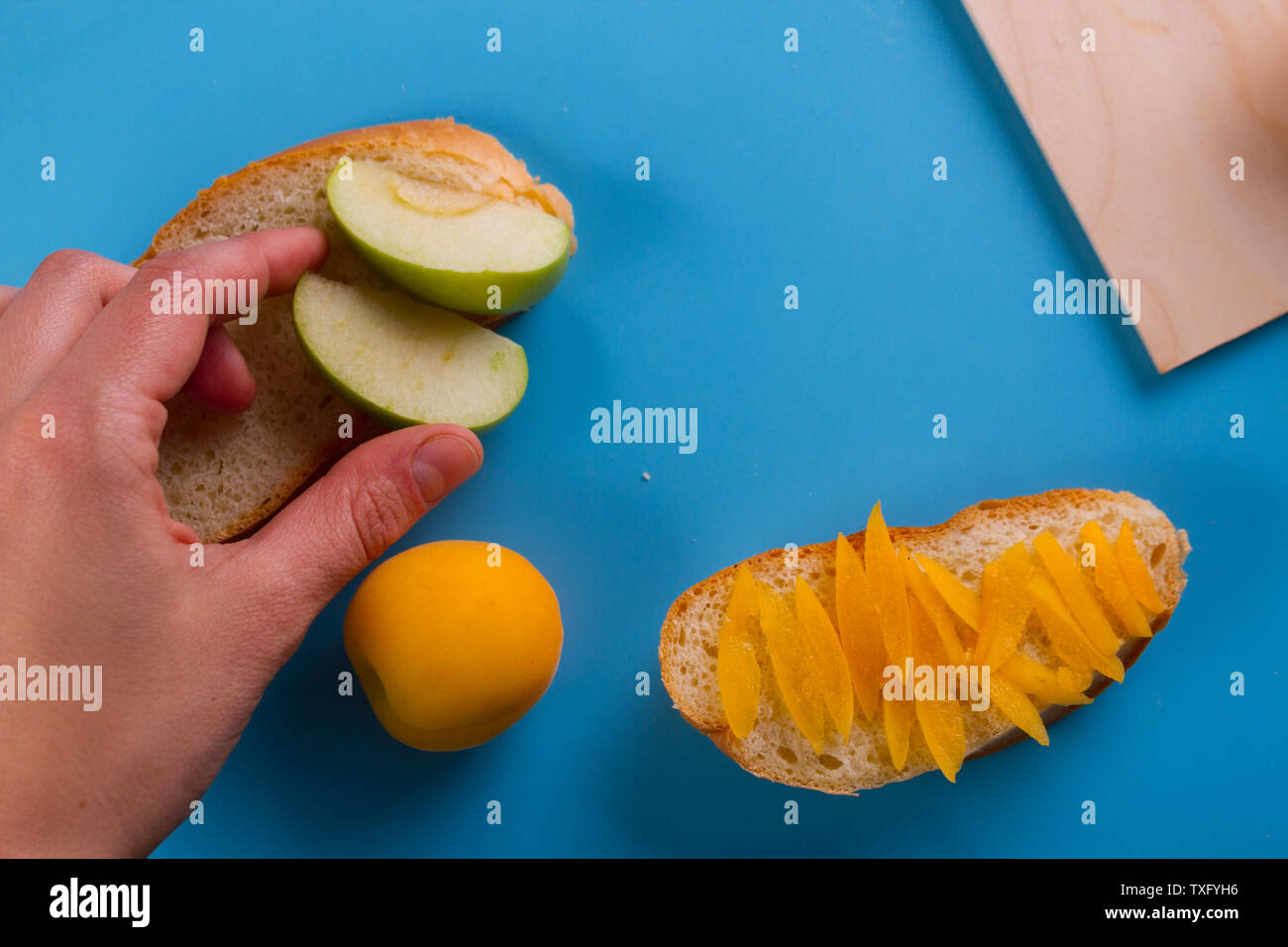 sandwiches with fruits on the blue background Stock Photo - Alamy