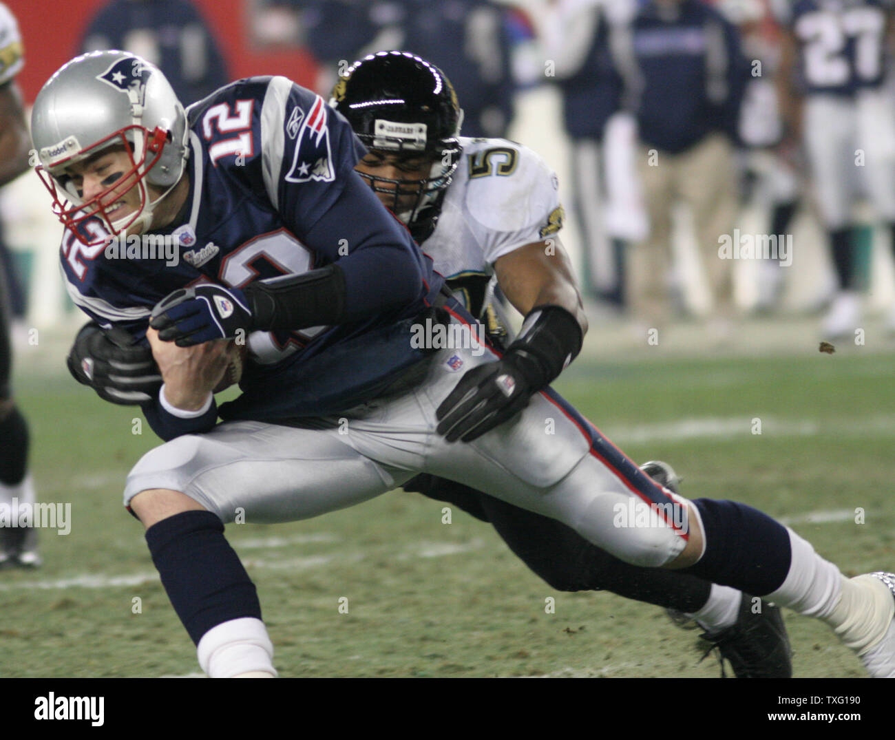 New England Patriots quarterback Tom Brady gets tackled by Jacksonville ...