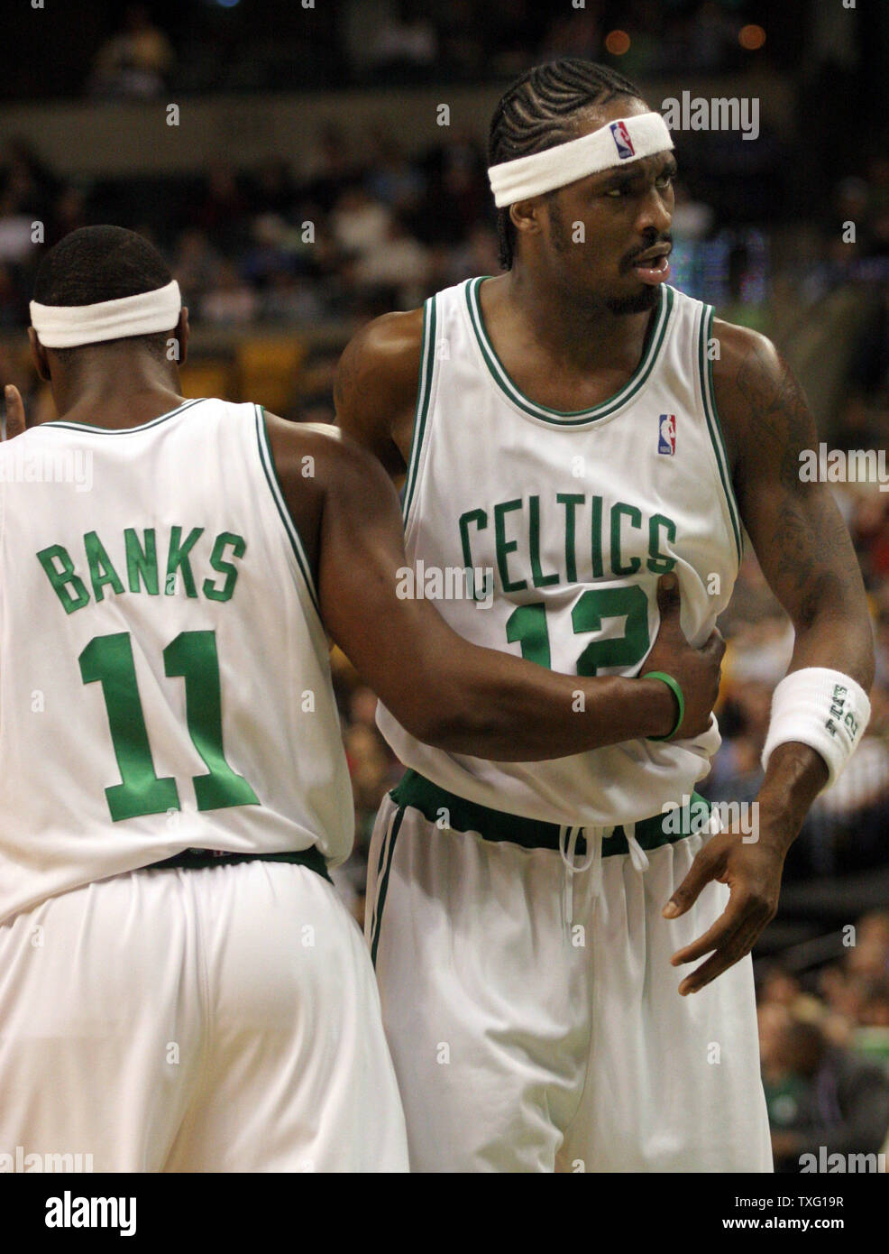 Boston Celtics guard Marcus Banks calms guard Ricky Davis as he ...