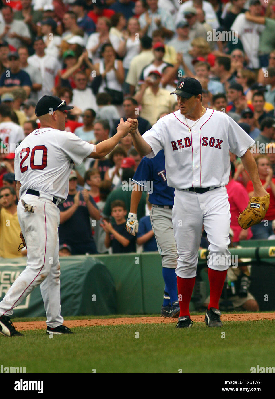 Boston Red Sox first baseman Kevin Youkilis congratulates Mike Timlin ...