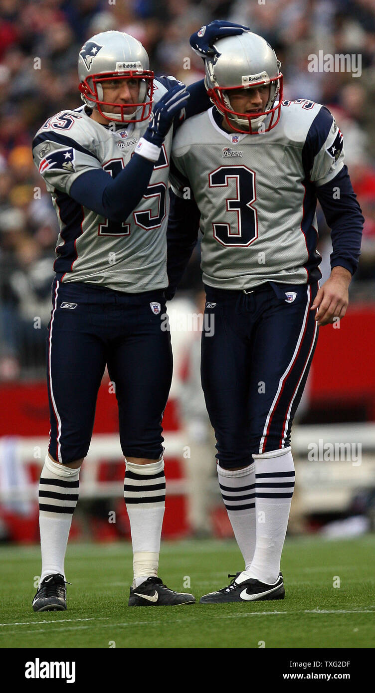 New England Patriots place holder Ken Walter congratulates kicker ...