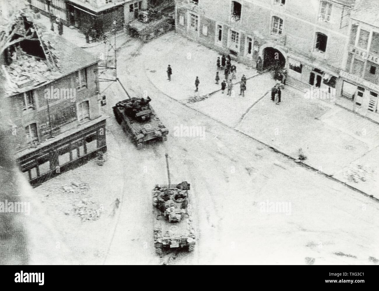 American Sherman firefly tanks entering the village of Douvres la ...