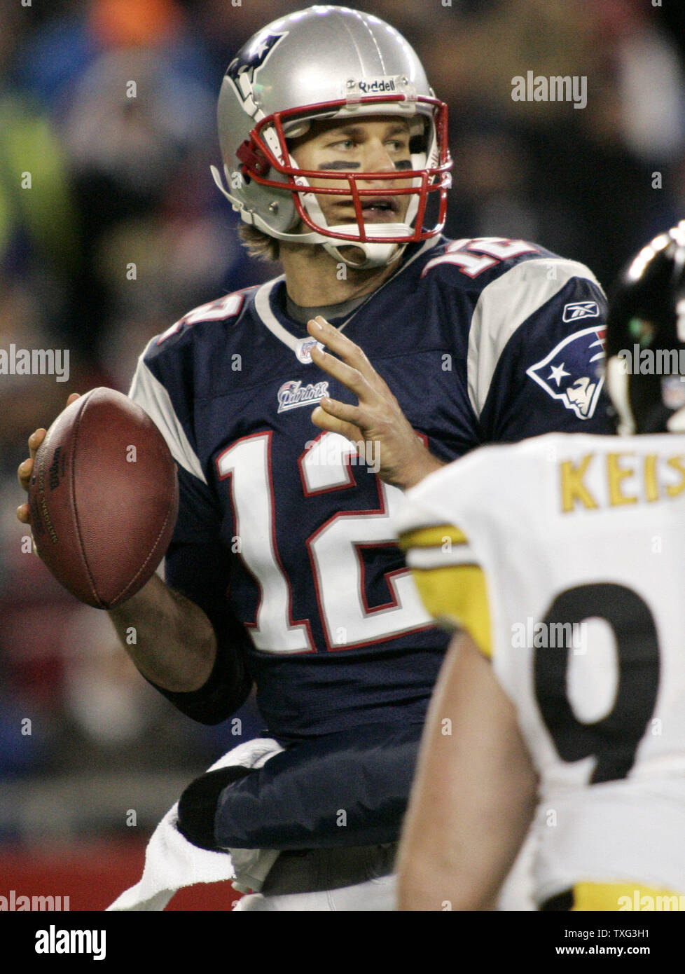 New England Patriots quarterback Tom Brady drops back for a pass in the ...