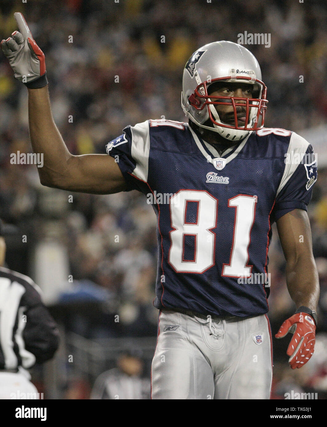 New England Patriots wide receiver Randy Moss points to the crowd after ...