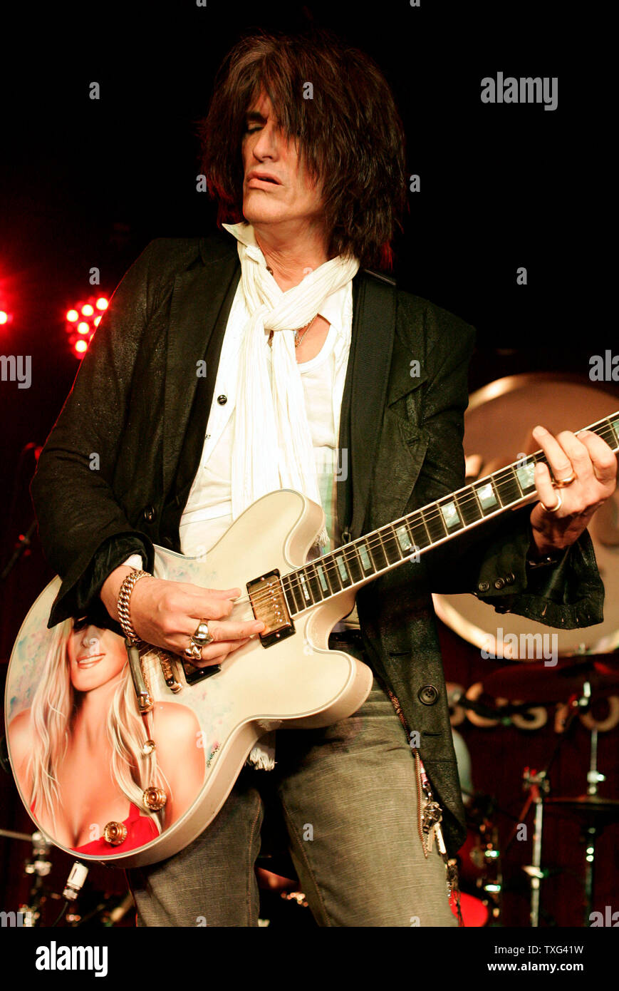 Joe Perry of the band Aerosmith performs with his two sons Tony Perry ...