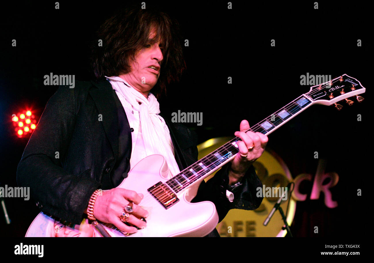 Joe Perry of the band Aerosmith performs with his two sons Tony Perry ...
