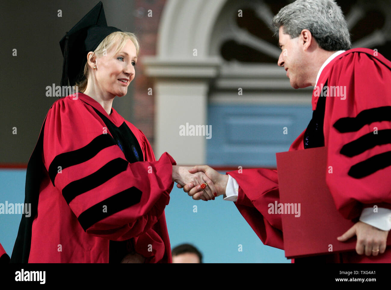 Author J.K. Rowling (L) shakes hands with Marc Goodheart of Harvard ...