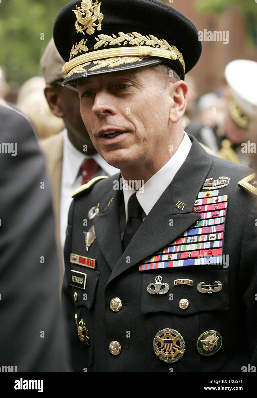 General David Patraeus makes his way through the crowd after attending ...
