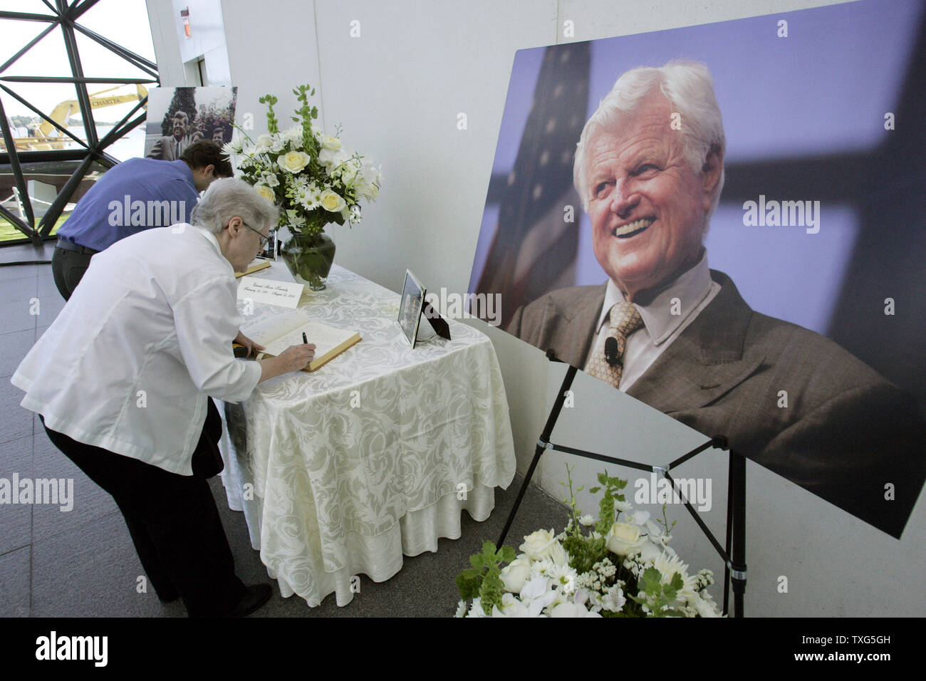 Mary Ellen Peters of Belmont, Massachusetts signs a condolence book for ...