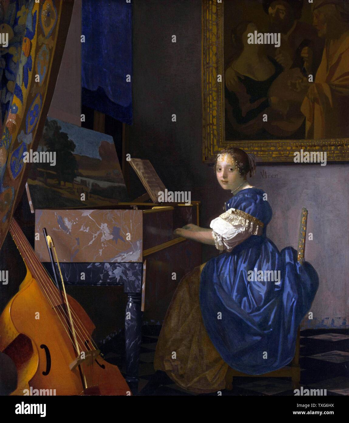 Johannes Vermeer Dutch school A Young Woman seated at a Virginal c.1670 ...