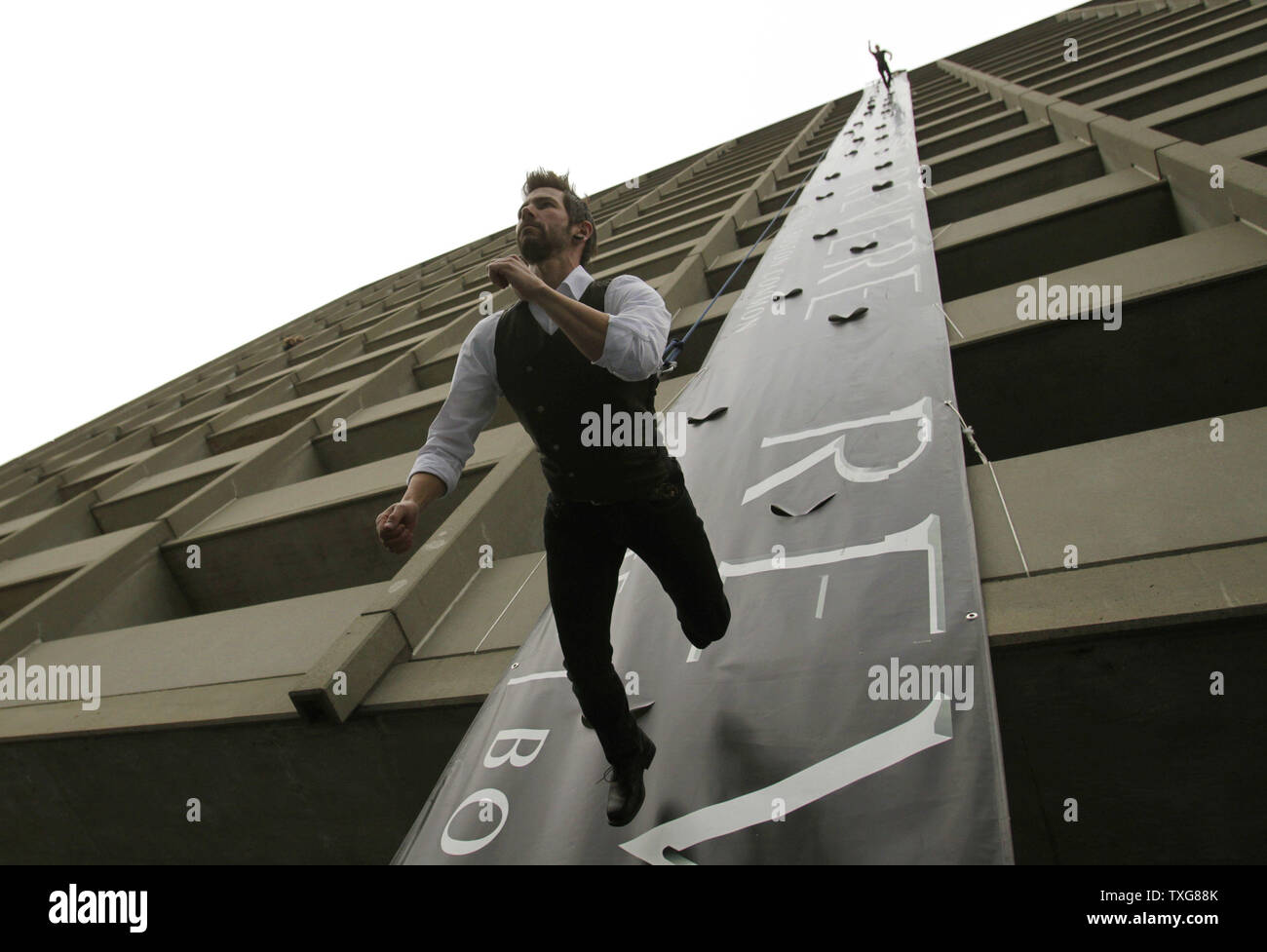 Climber and model Adam Kline of Malden, Massachusetts rappels down the ...