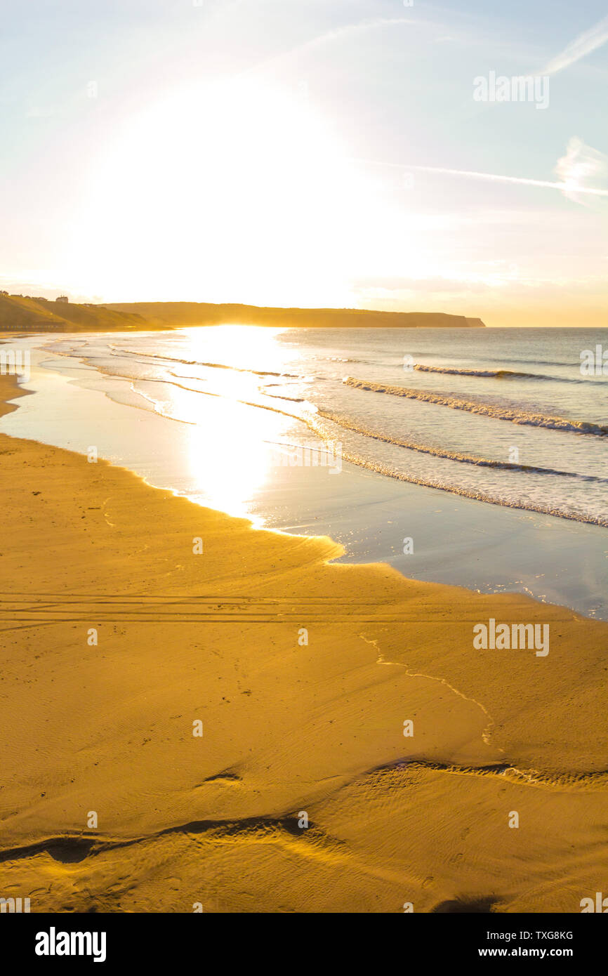 Sand and waves in Whitby Stock Photo - Alamy