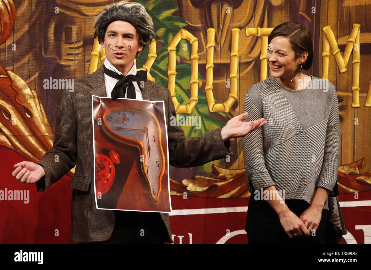 Actress Marion Cotillard (R) acts out a skit with Harvard senior ...