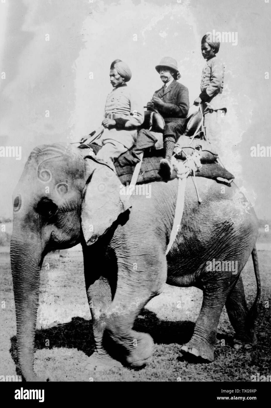 George V, King of the United Kingdom from 1936. Riding on an elephant ...