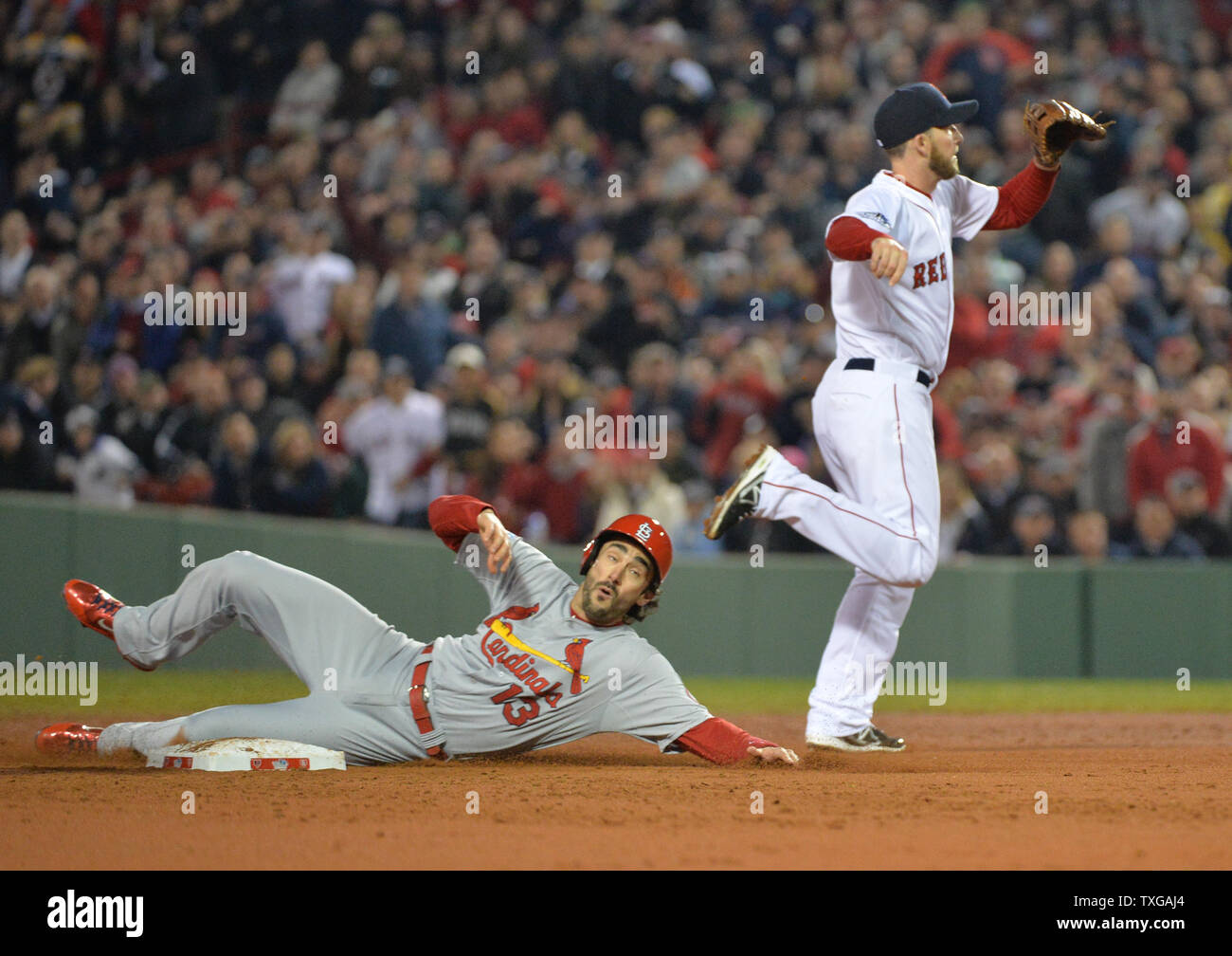 Boston Red Sox Dustin Pedroia (R) forces St. Louis Cardinals Matt ...