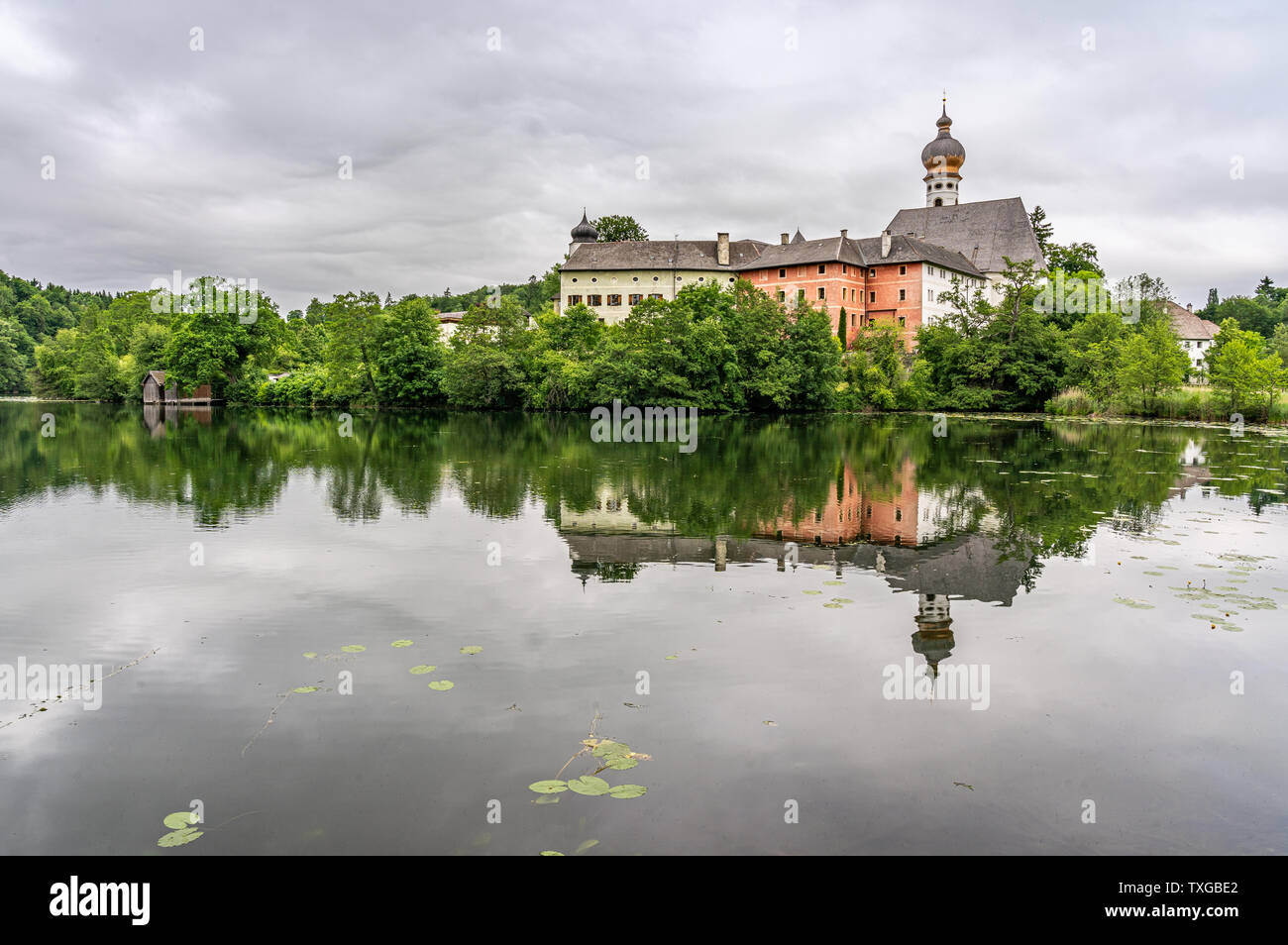 hoeglwoerth abbey and its reflection in the lake near anger in bavaria ...