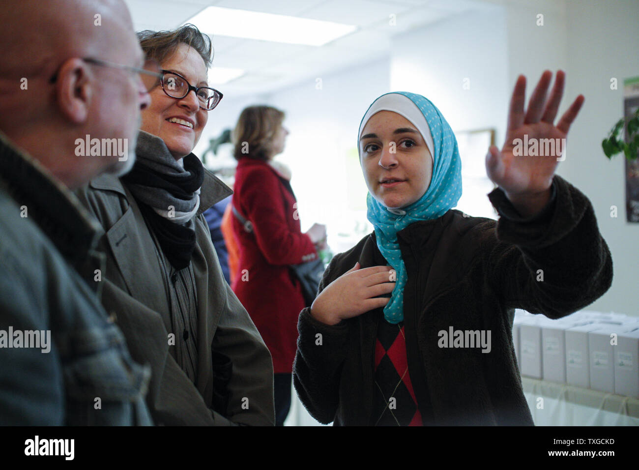 Jena Khreim (R) greets Ann Feldman (C) and Rich Feldman during 'Meet-a ...