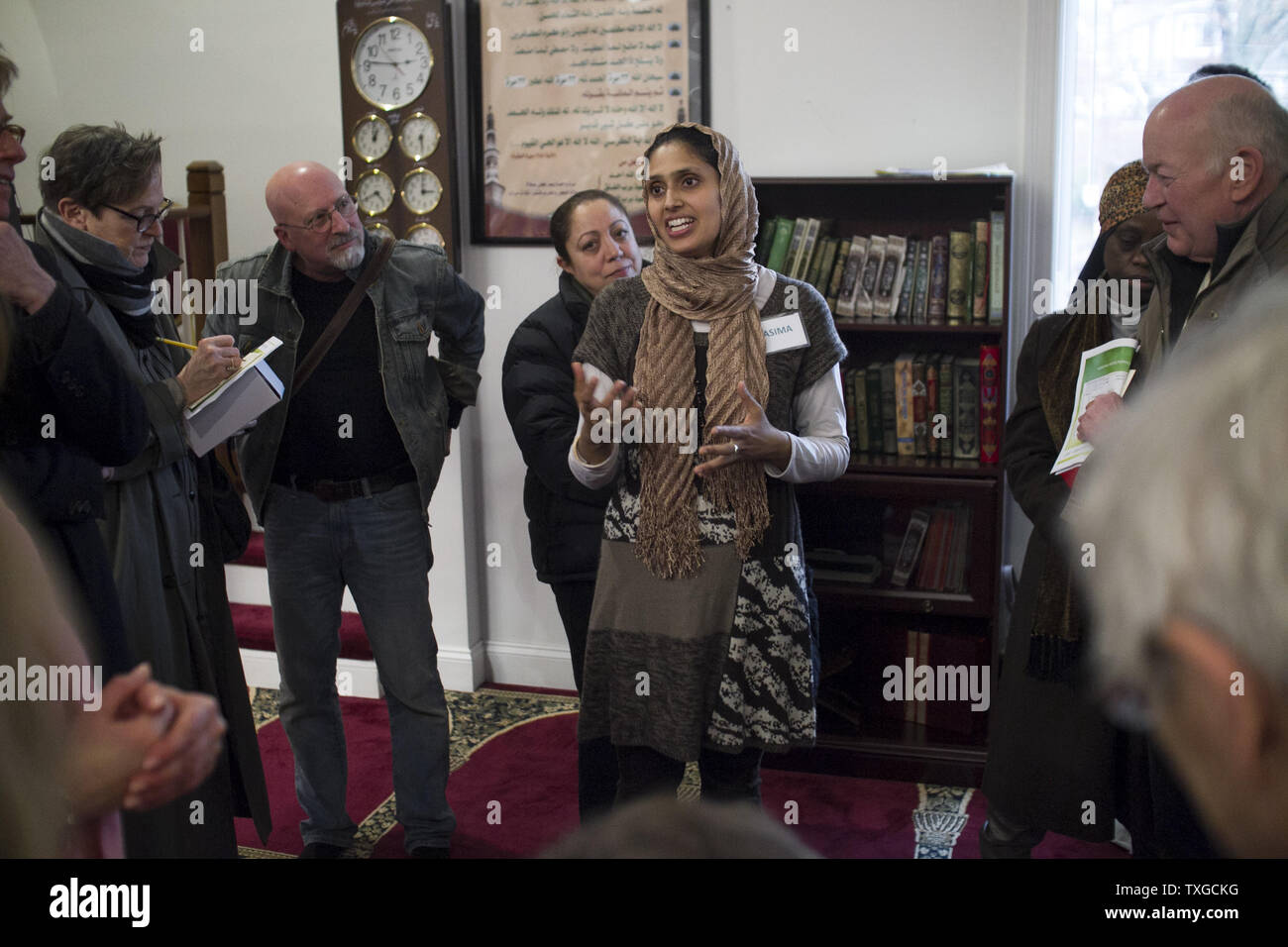 Asima Silva (C) gives a tour of the Worcester Islamic Center during ...