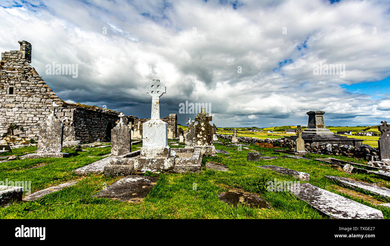 View of the ruins of the medieval church of Killilagh and the graveyard ...