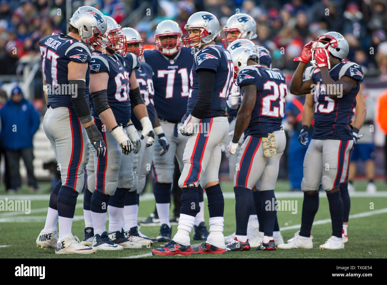 New England Patriots quarterback Tom Brady (12) looks to the sideline ...