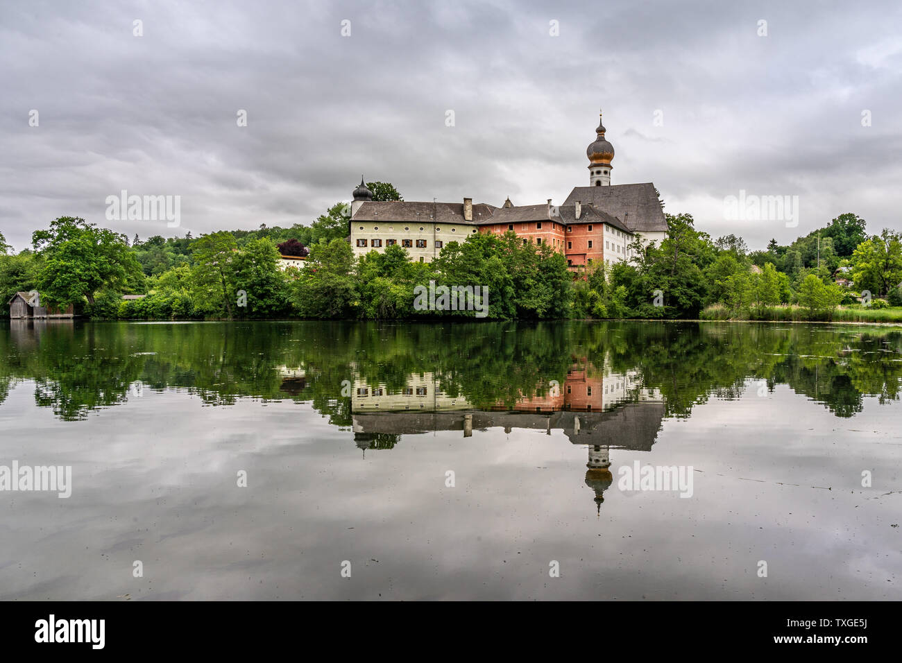hoeglwoerth abbey and its reflection in the lake near anger in bavaria ...