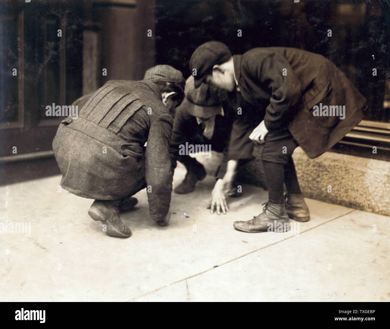 Photograph of children pitching pennies on the Main St. Fall River ...